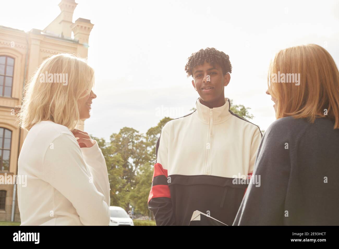 Teenagers talking together Stock Photo - Alamy
