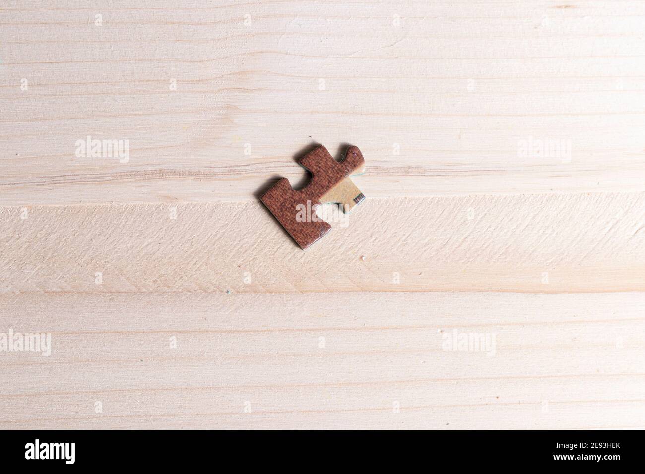 making a puzzle over a table Stock Photo - Alamy
