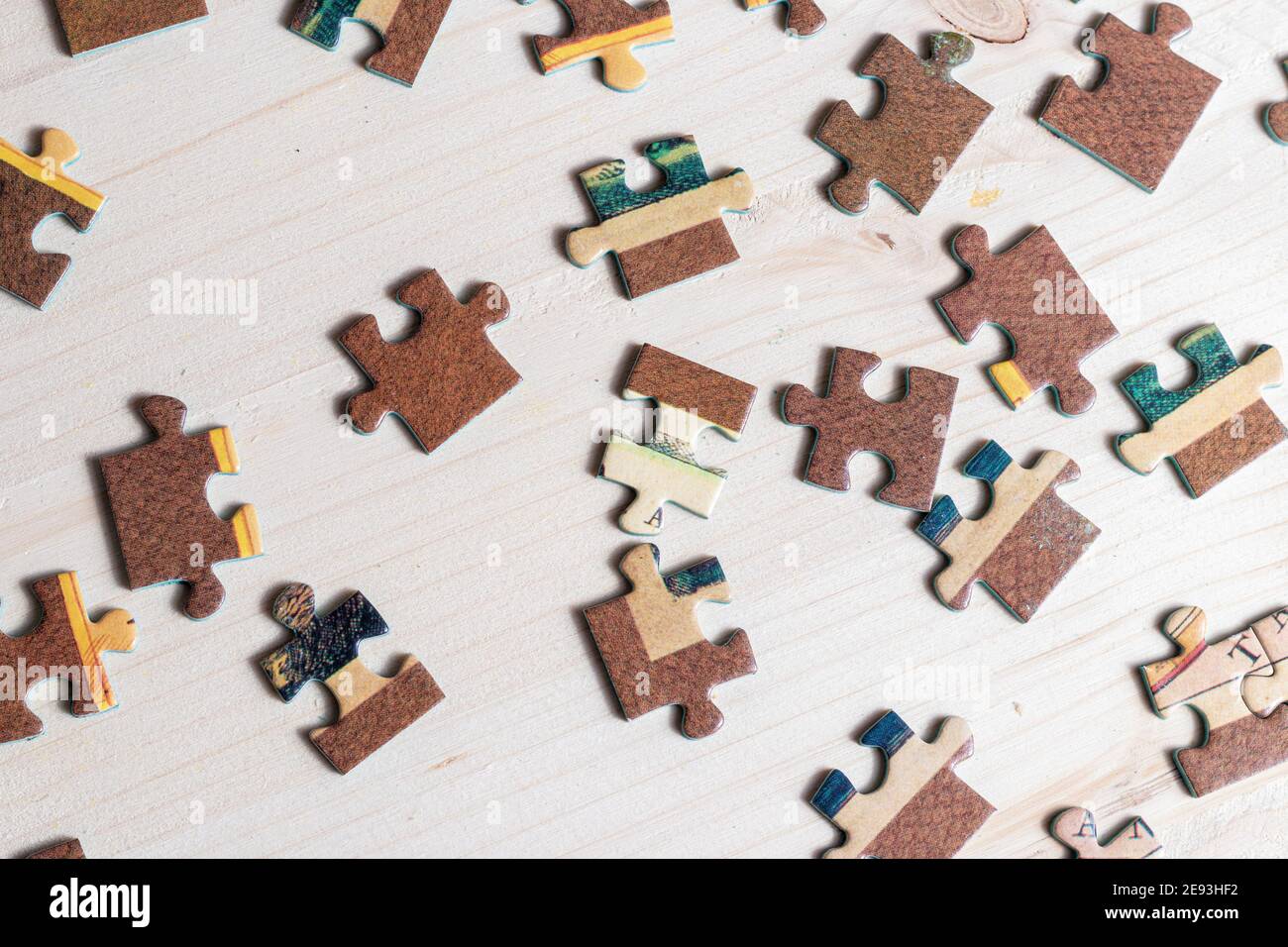 making a puzzle over a table Stock Photo - Alamy