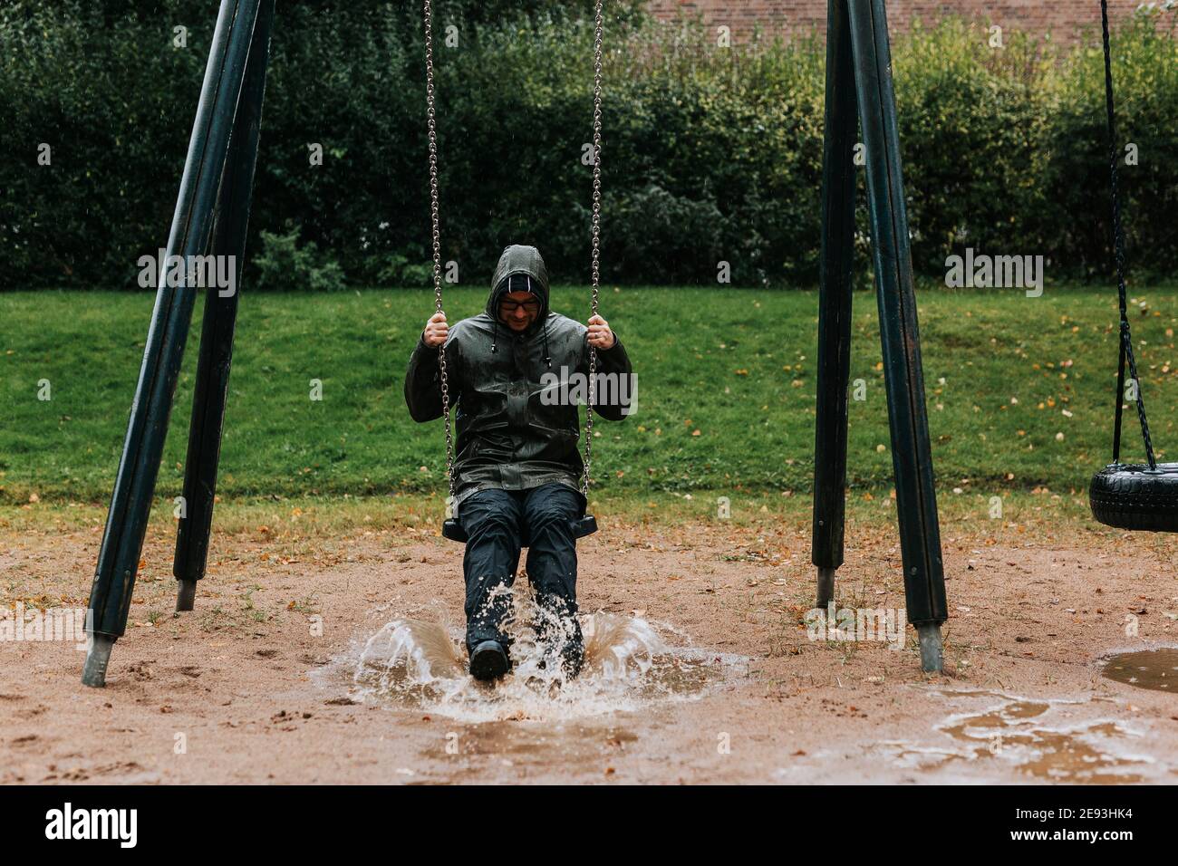Man jumping in puddle hi-res stock photography and images - Alamy