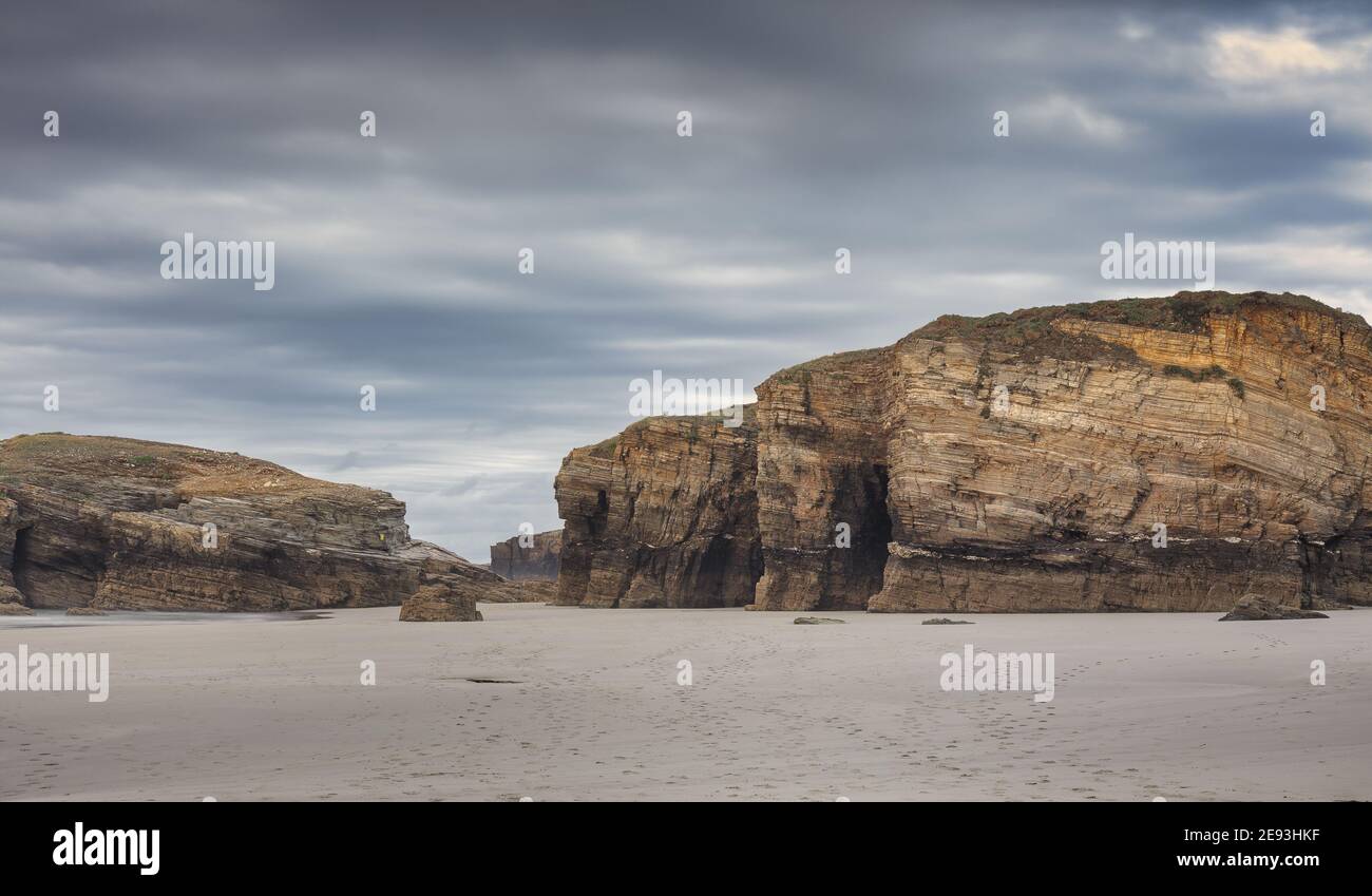 Beautiful rainy cloudscape over rugged cliffs in As Catedrais beach in ...