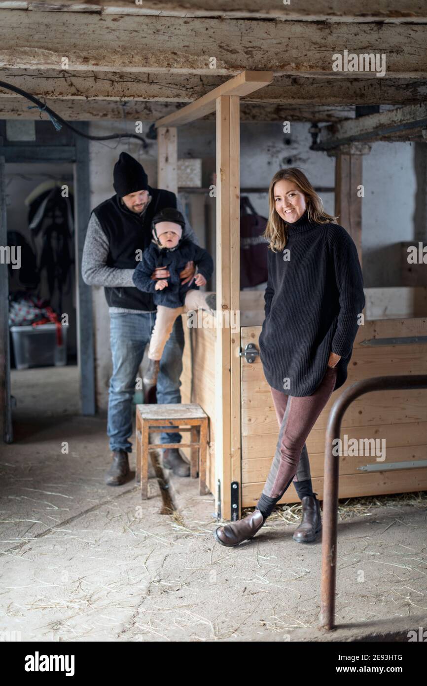 Family in stable Stock Photo - Alamy