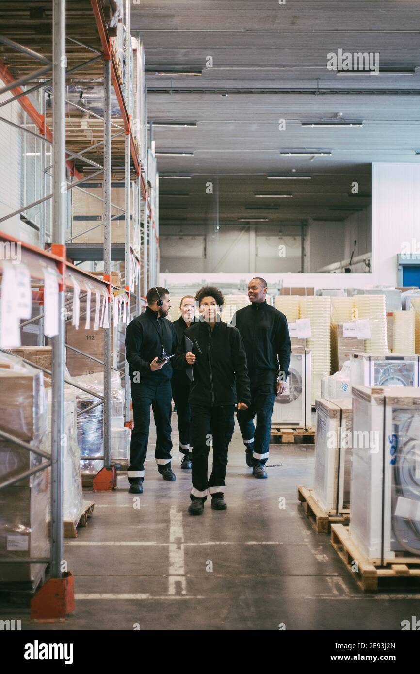 Male warehouse workers discussing hi-res stock photography and images ...