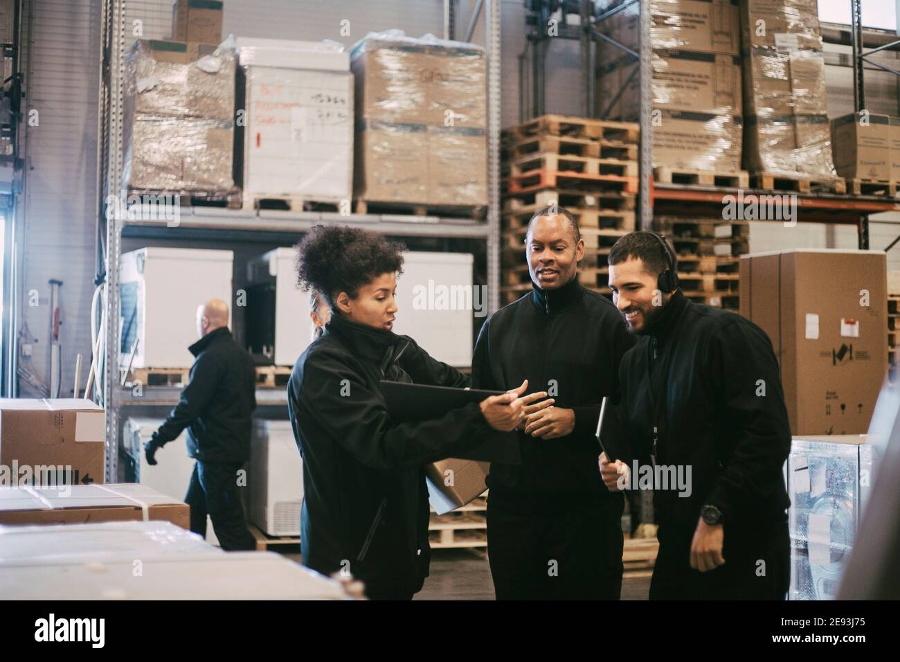 Businesswoman explaining colleagues during meeting in logistics ...