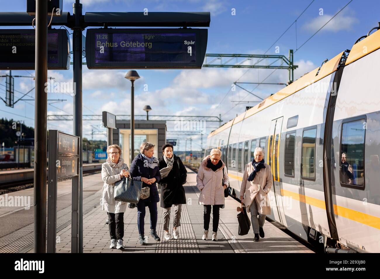 Passengers at train platform Stock Photo - Alamy