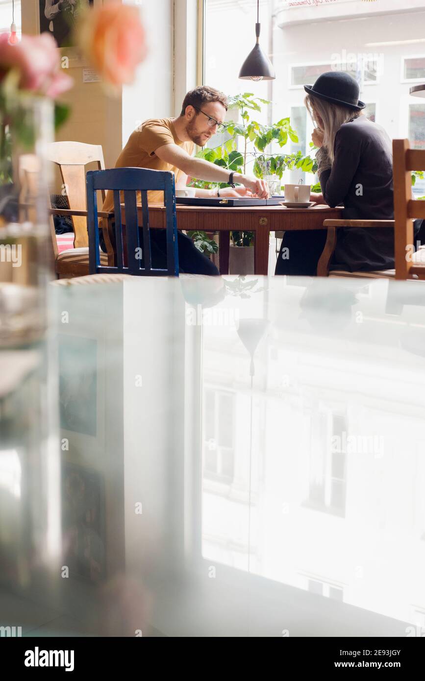 Reflection on table in cafe Stock Photo - Alamy