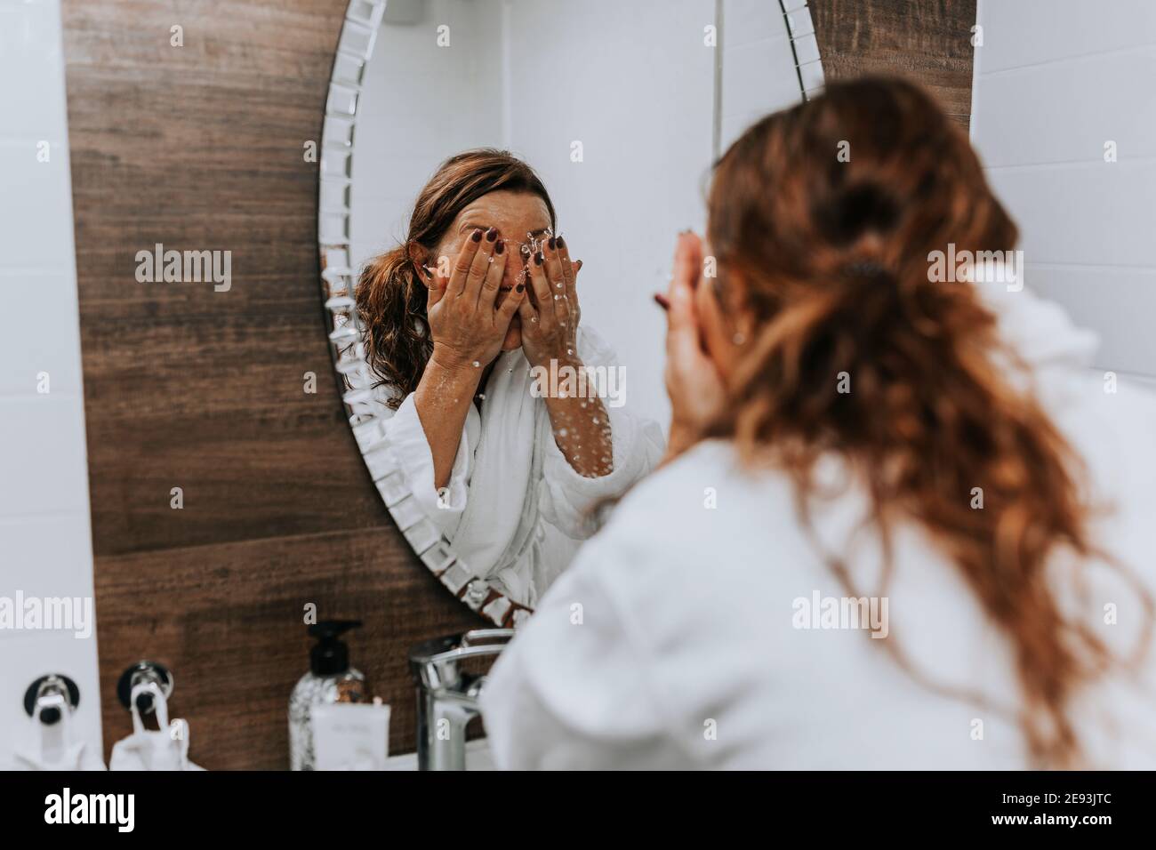 Person washing face in front hi-res stock photography and images - Alamy