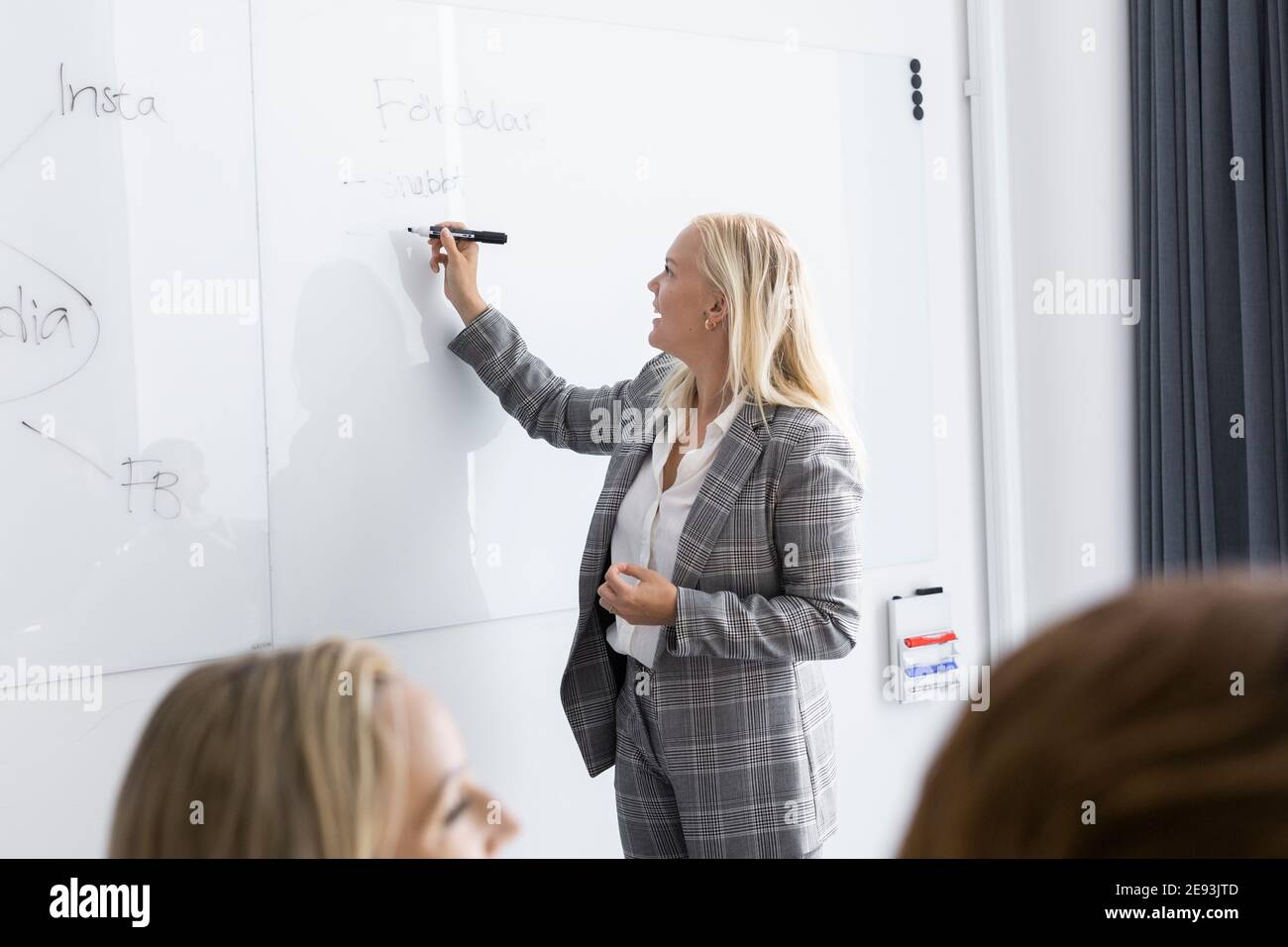 Woman having presentation at business meeting Stock Photo - Alamy