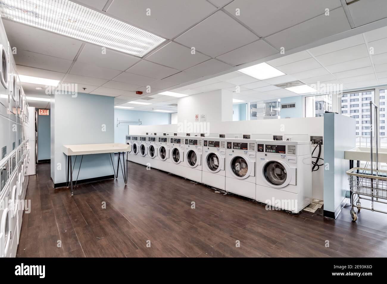 A downtown high rise laundry room with Speed Queen front load washers ...