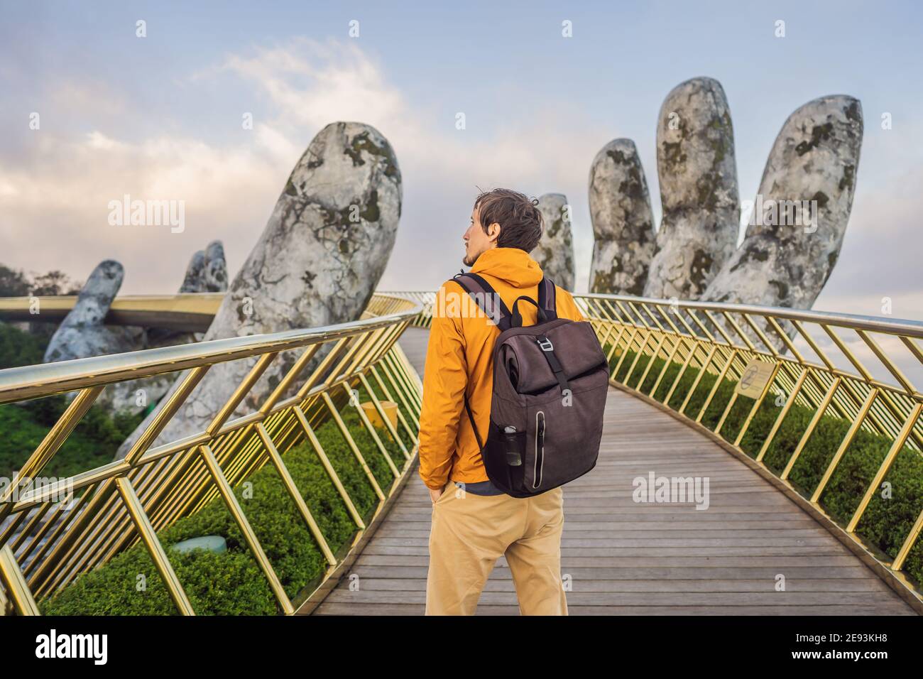 Young man tourist at Famous tourist attraction - Golden bridge at the ...