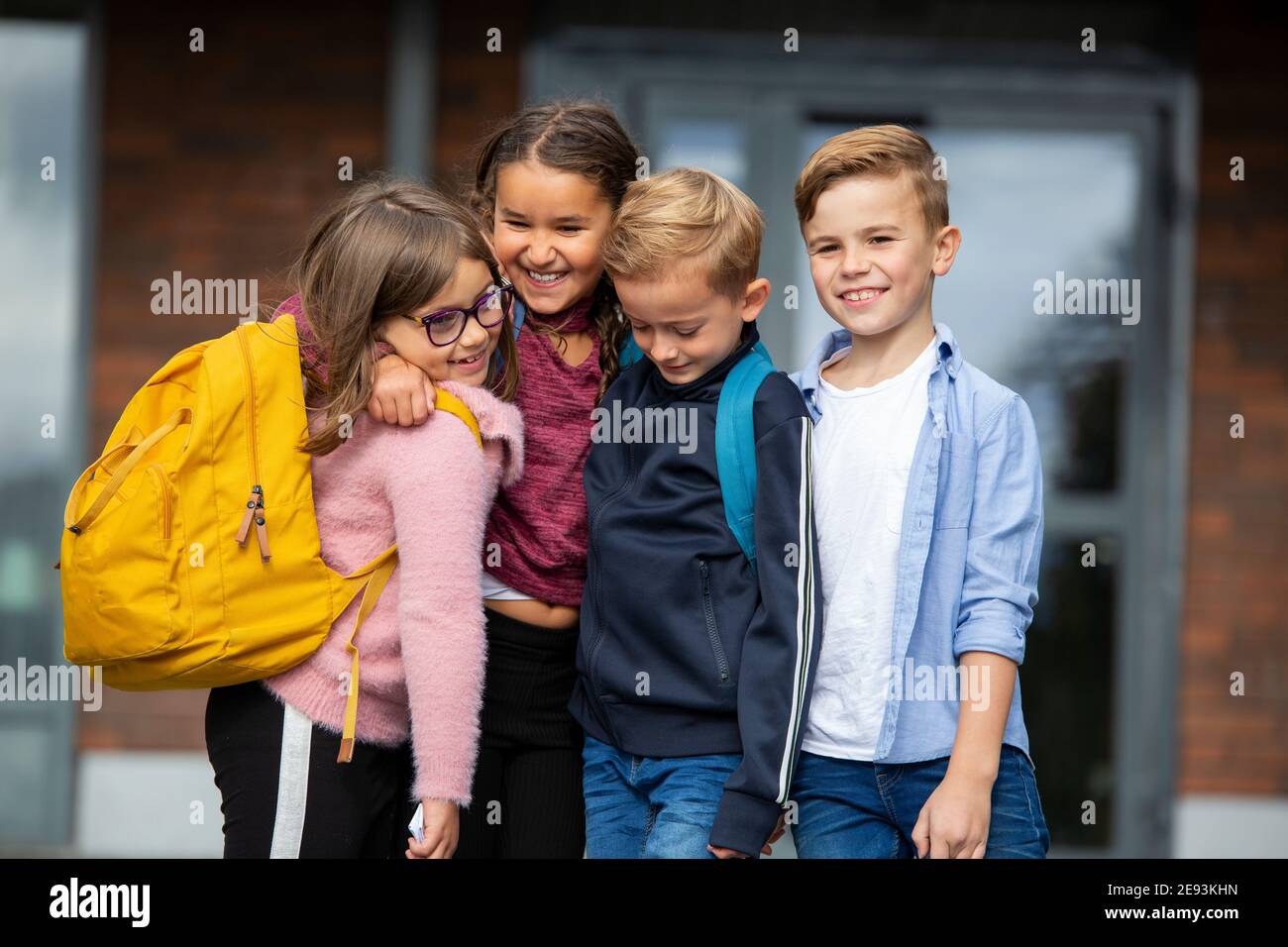 Children standing in front of school Stock Photo - Alamy