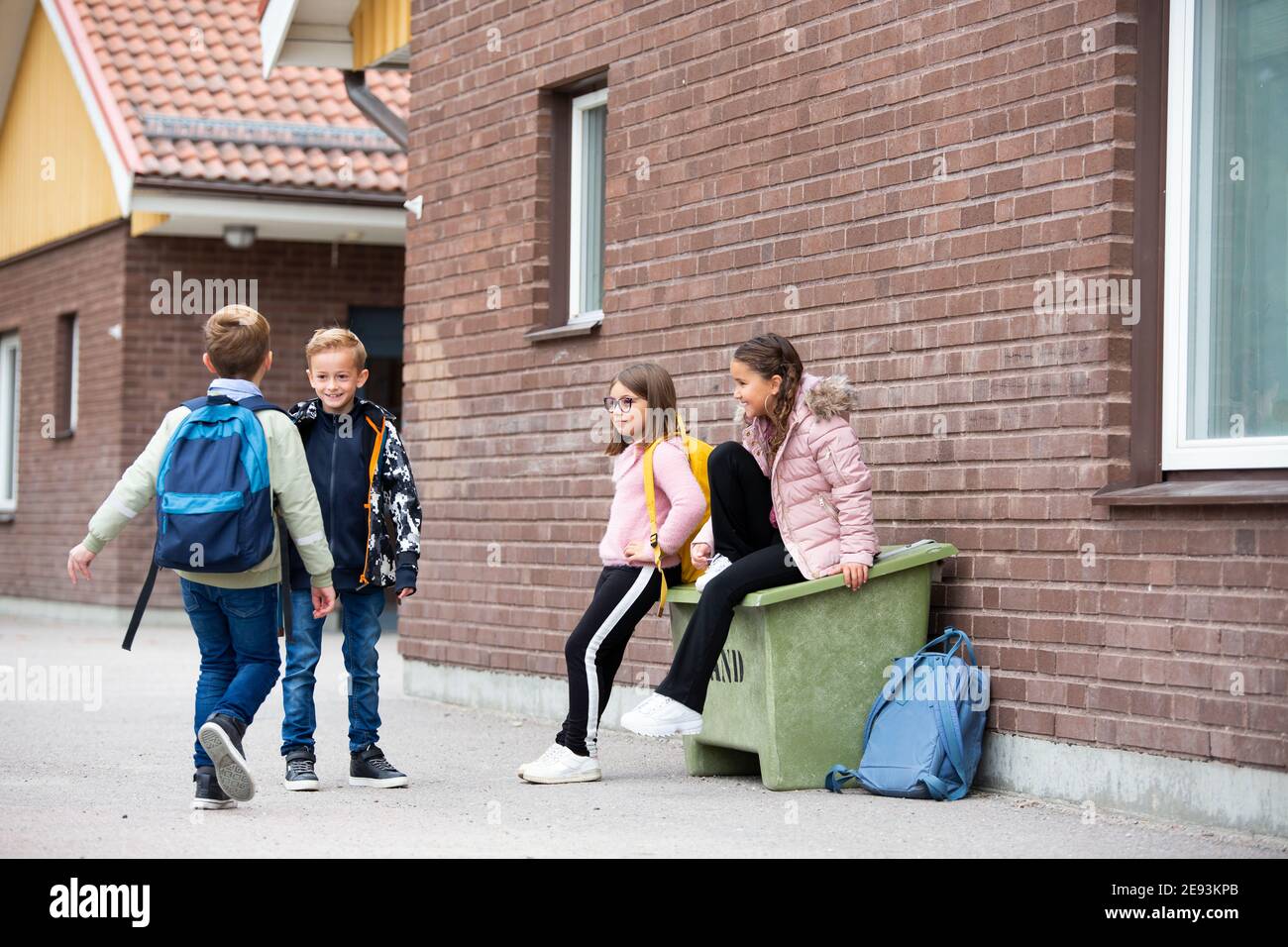 Smiling children in front of school Stock Photo - Alamy