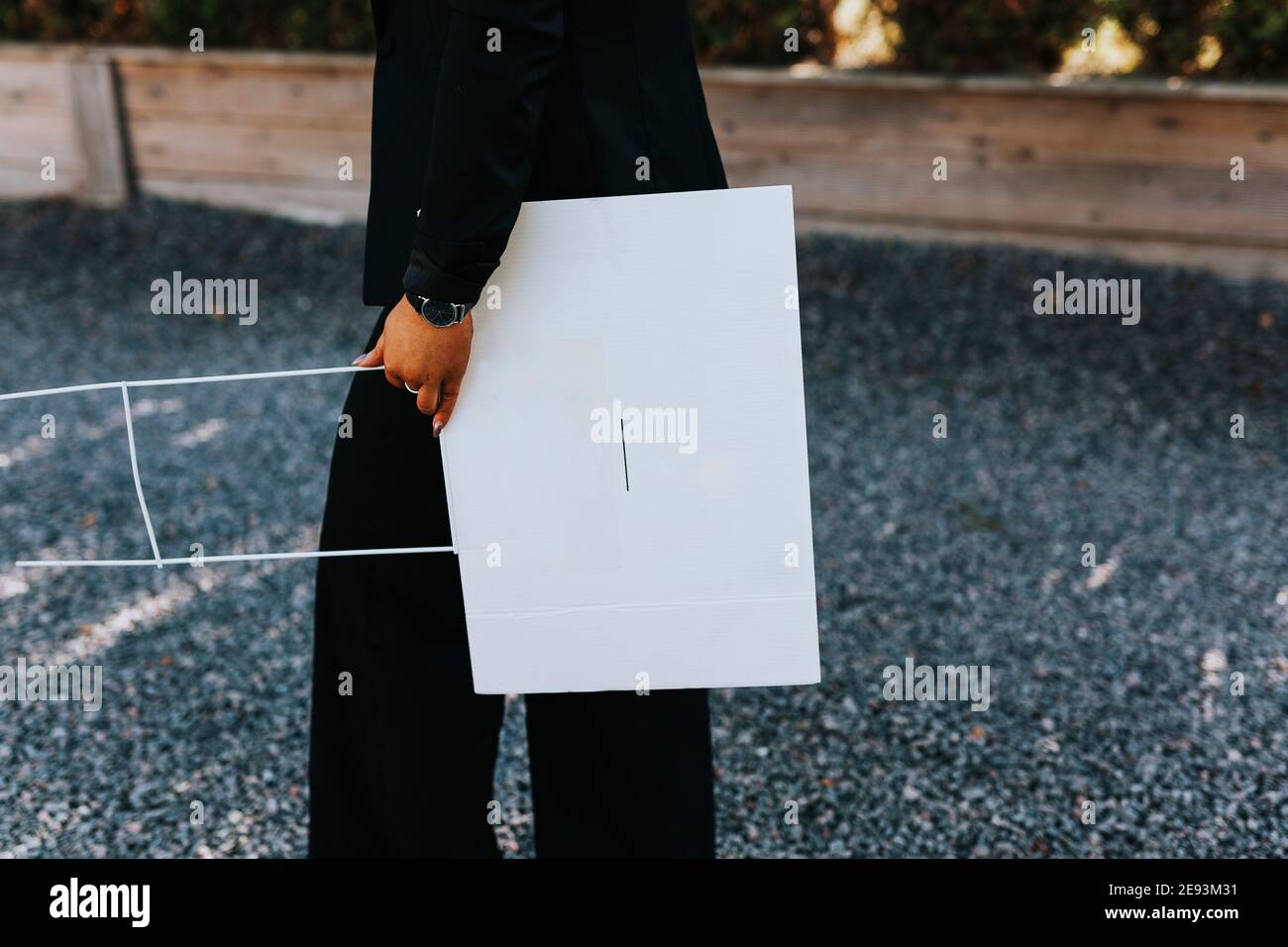 Woman holding for sale sign Stock Photo - Alamy