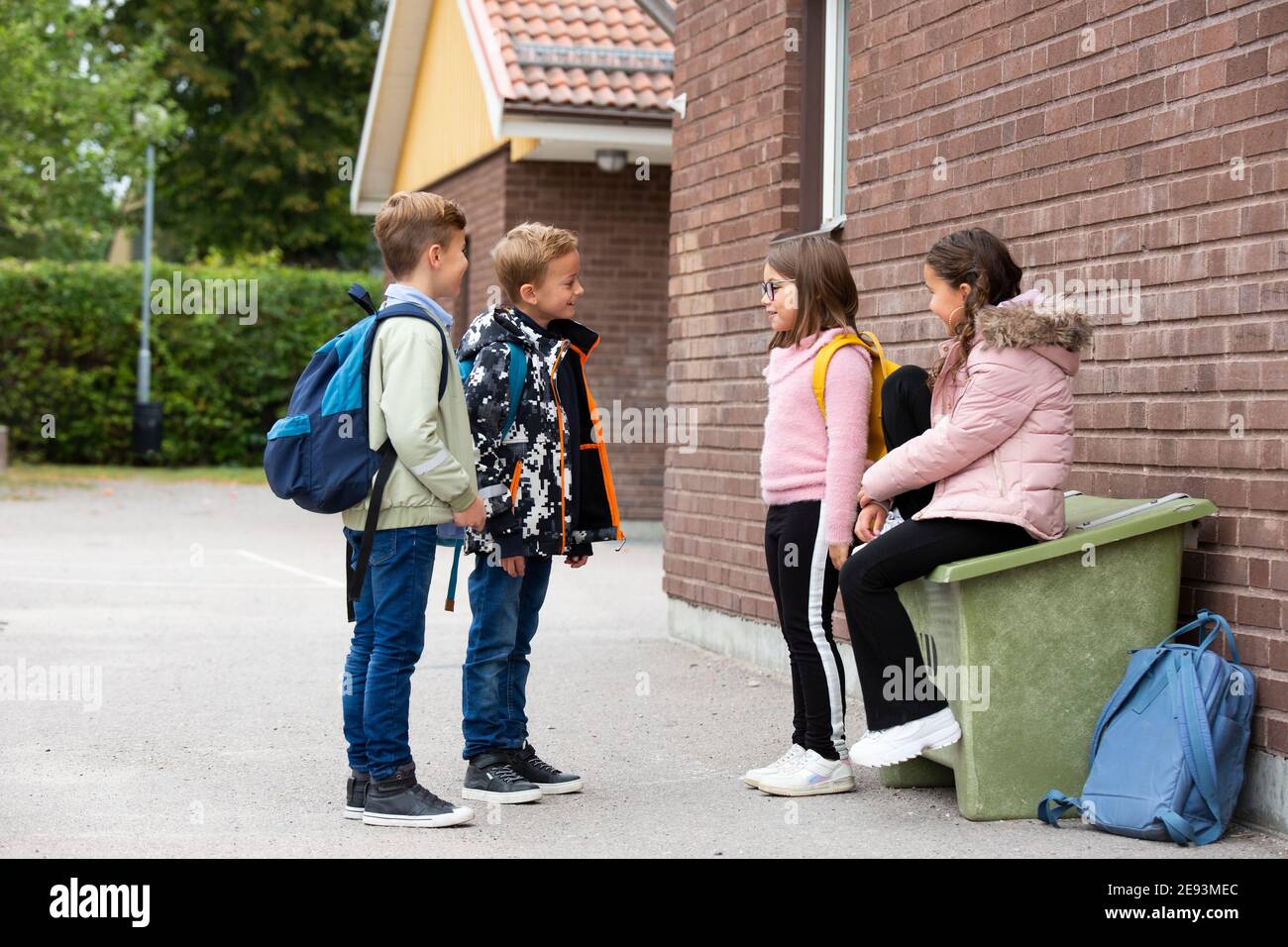 Boy and girl talking school hi-res stock photography and images - Alamy