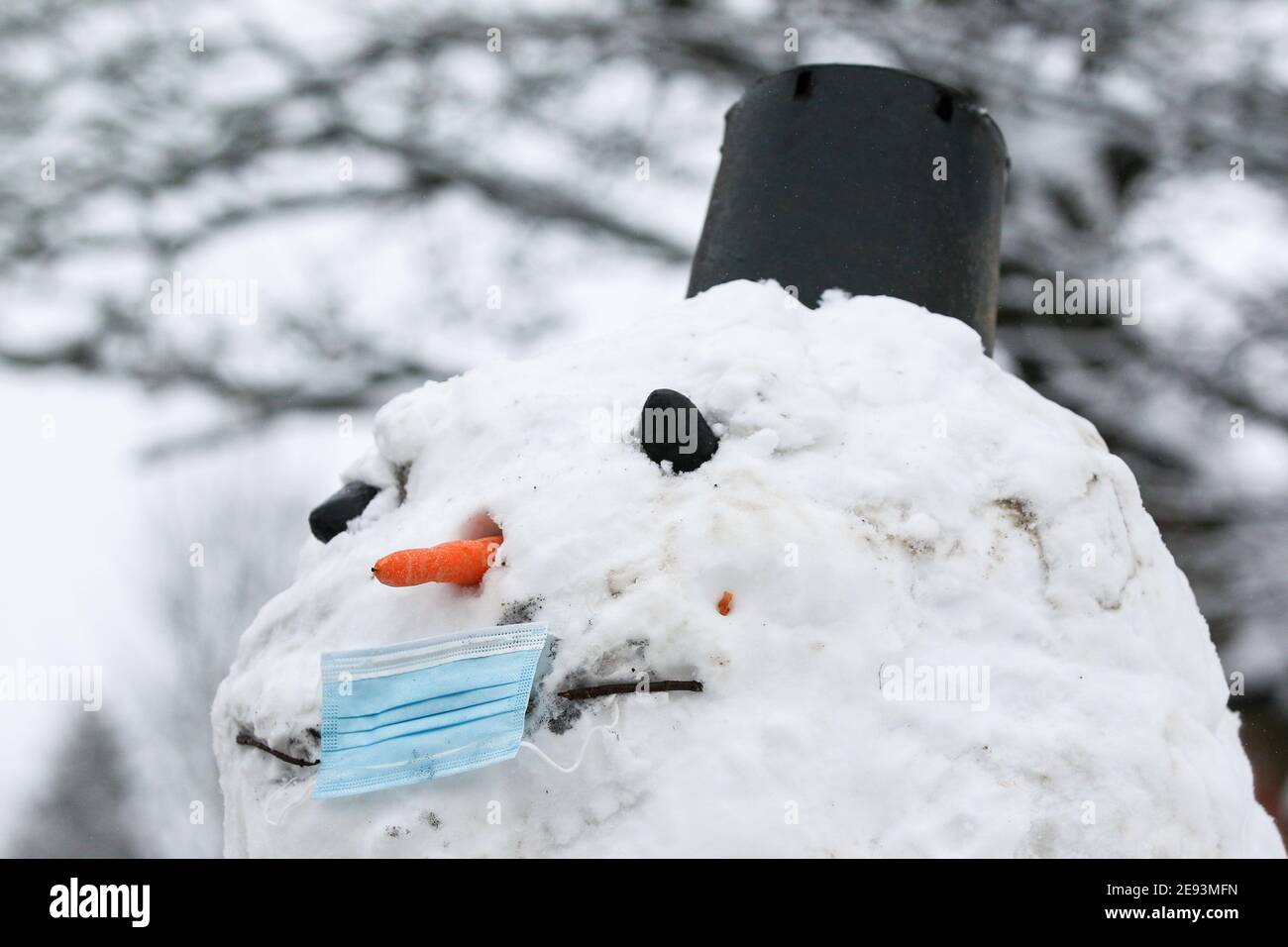 A snowman wearing a facemask.Heavy snow fell overnight in West ...