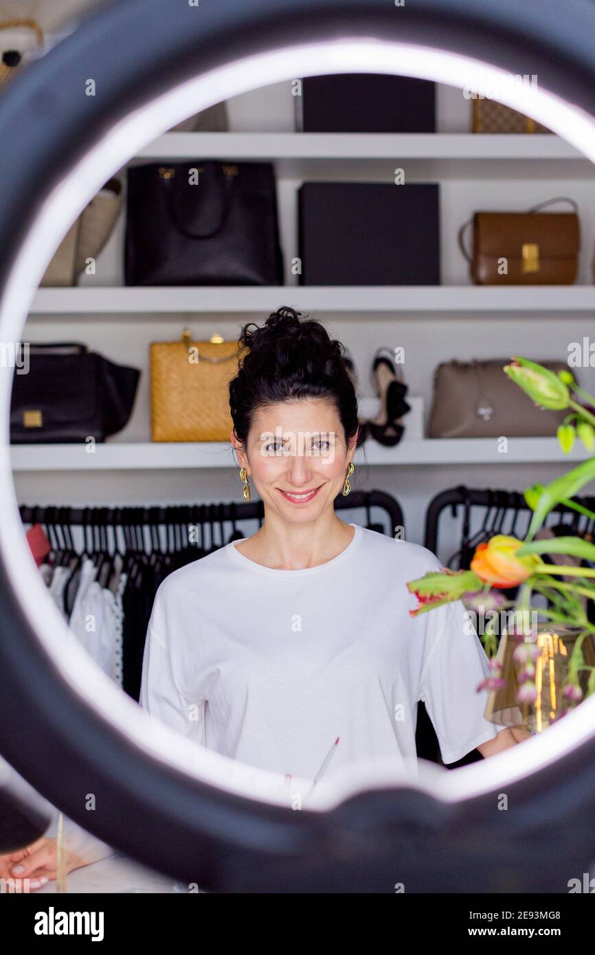 Female influencer with illuminated lighting equipment at home Stock ...
