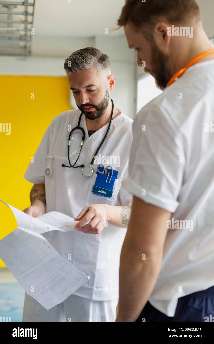 Doctors talking in hospital Stock Photo - Alamy