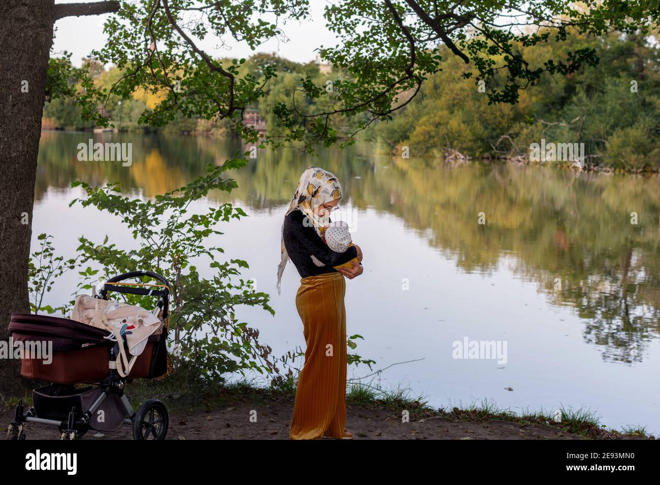 Mother with baby at lake Stock Photo - Alamy
