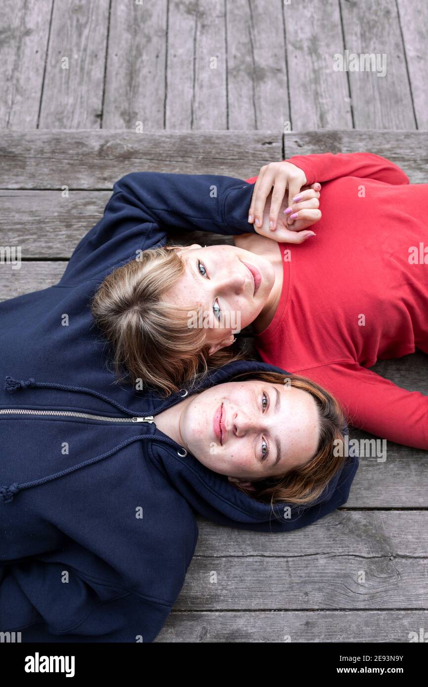 High angle view of teenage girls looking at camera Stock Photo - Alamy