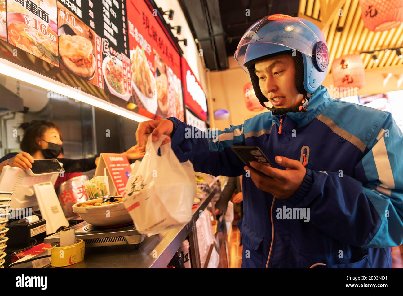 Take-away member take food in the restaurant Stock Photo - Alamy