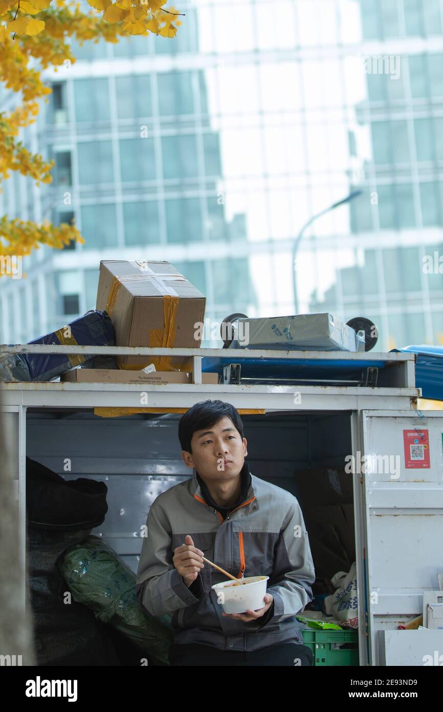 Courier sitting express bus for dinner Stock Photo - Alamy