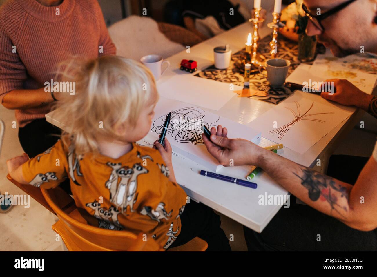 Parents drawing with toddler Stock Photo - Alamy