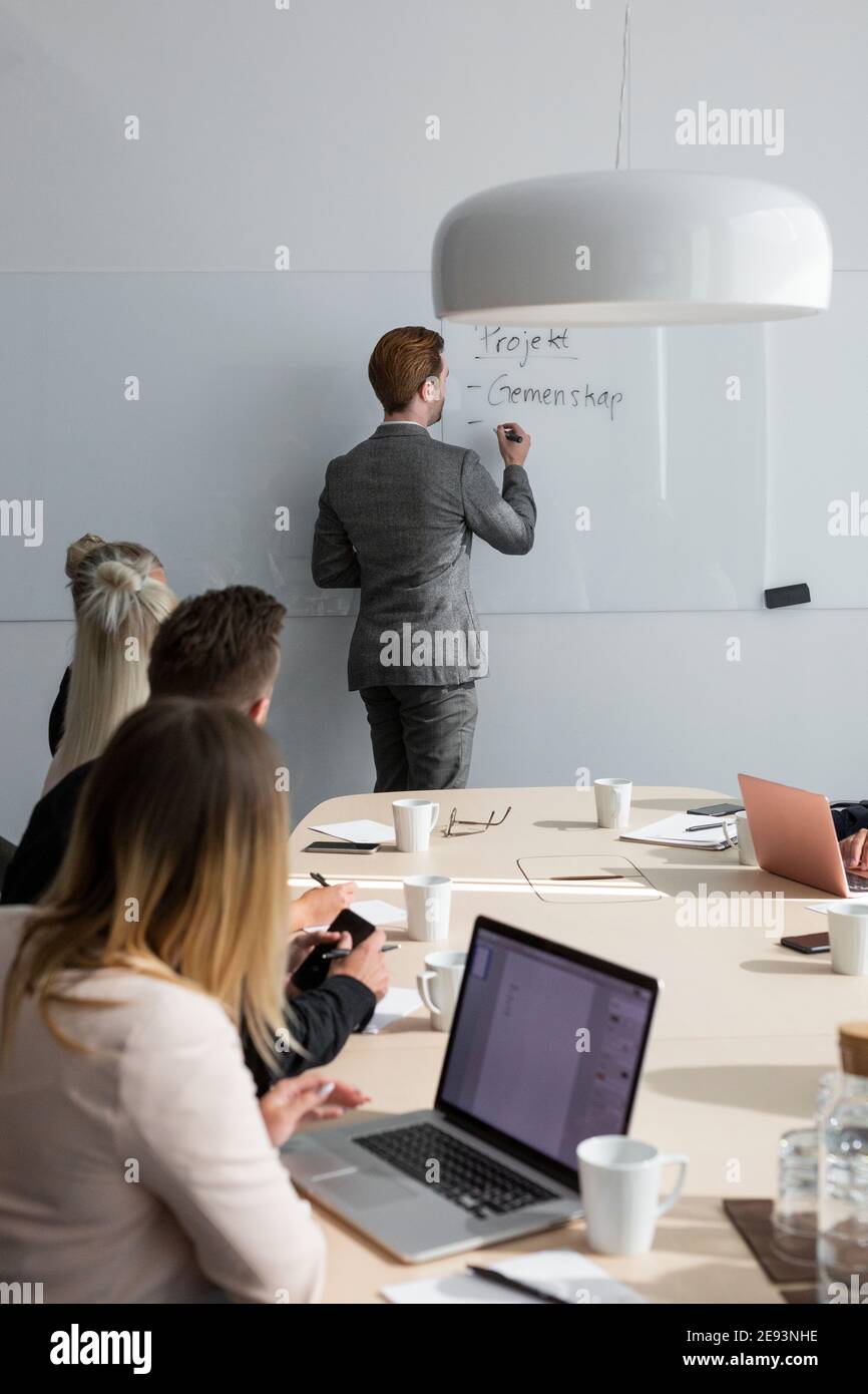 Man having presentation at business meeting Stock Photo - Alamy