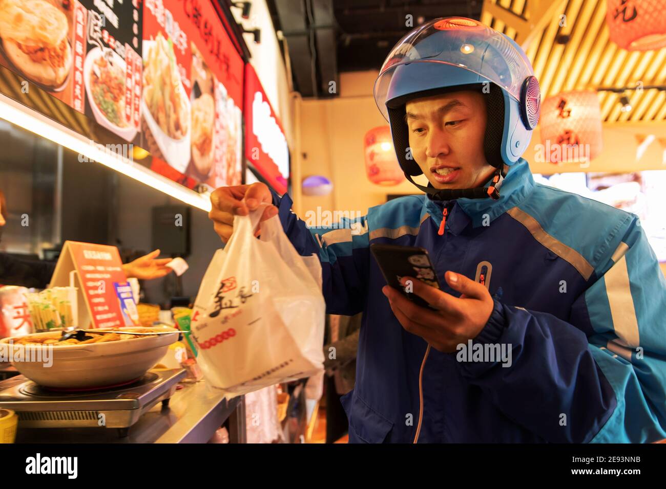 Take-away member take food in the restaurant Stock Photo - Alamy