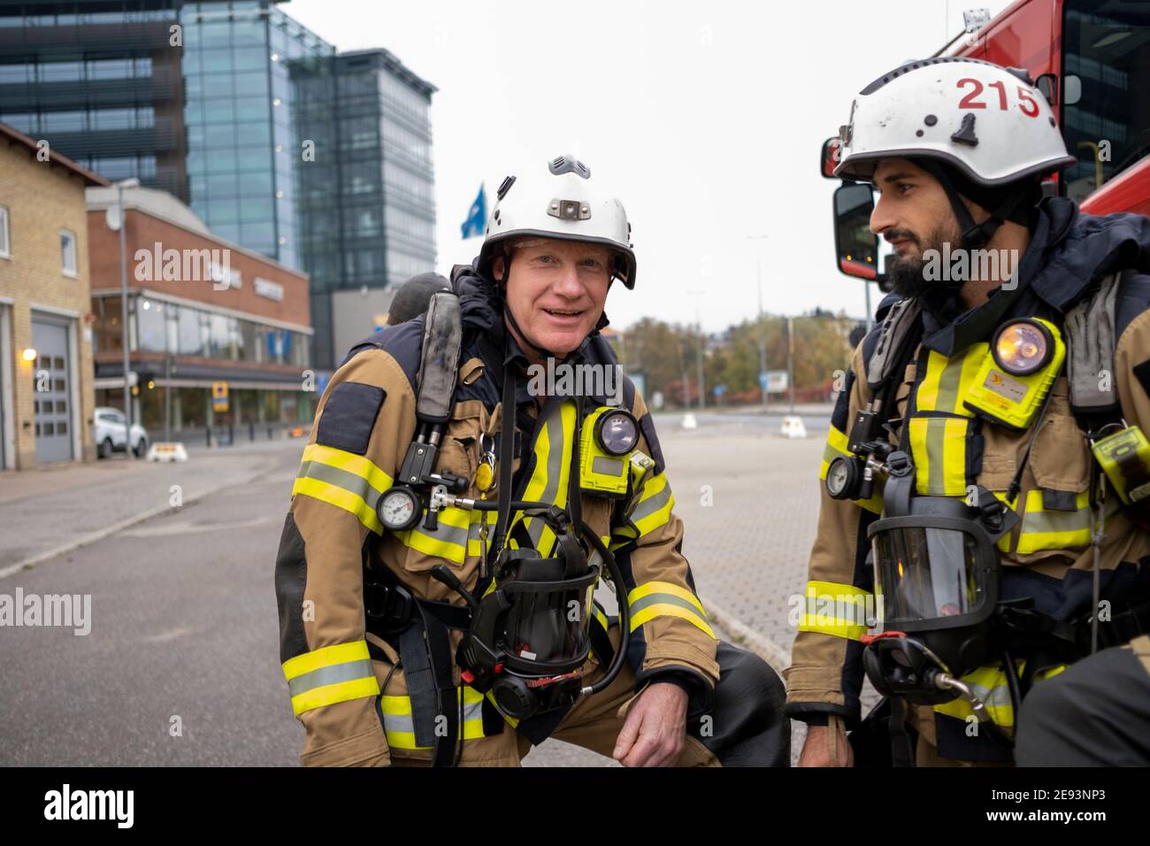 Smiling firefighters at work Stock Photo - Alamy