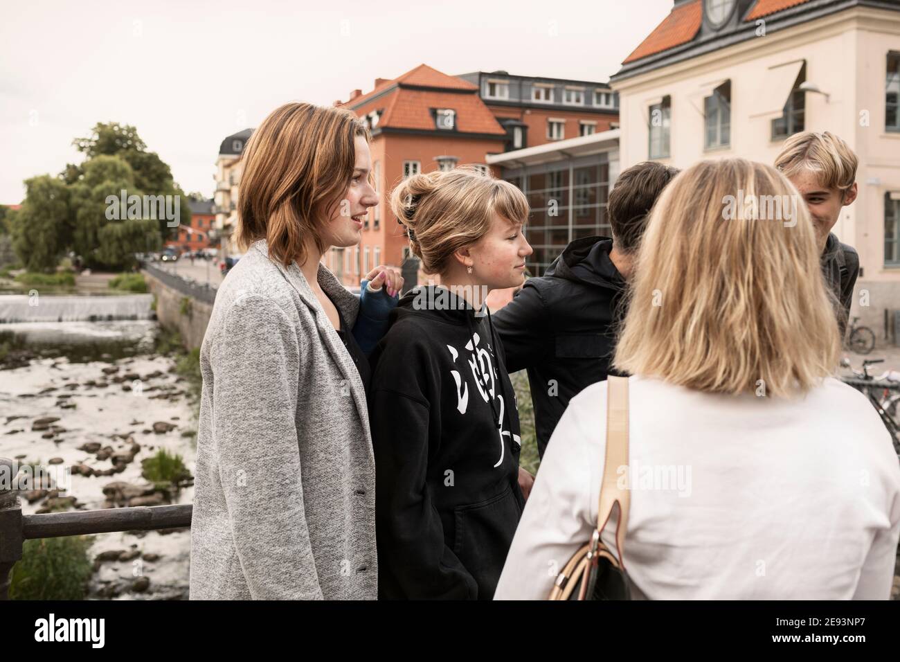 Smiling teenagers talking Stock Photo - Alamy