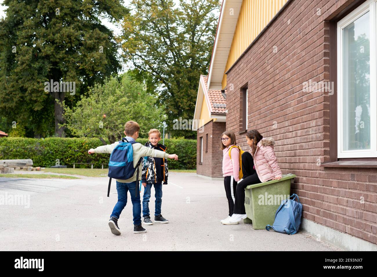 Smiling children in front of school Stock Photo - Alamy