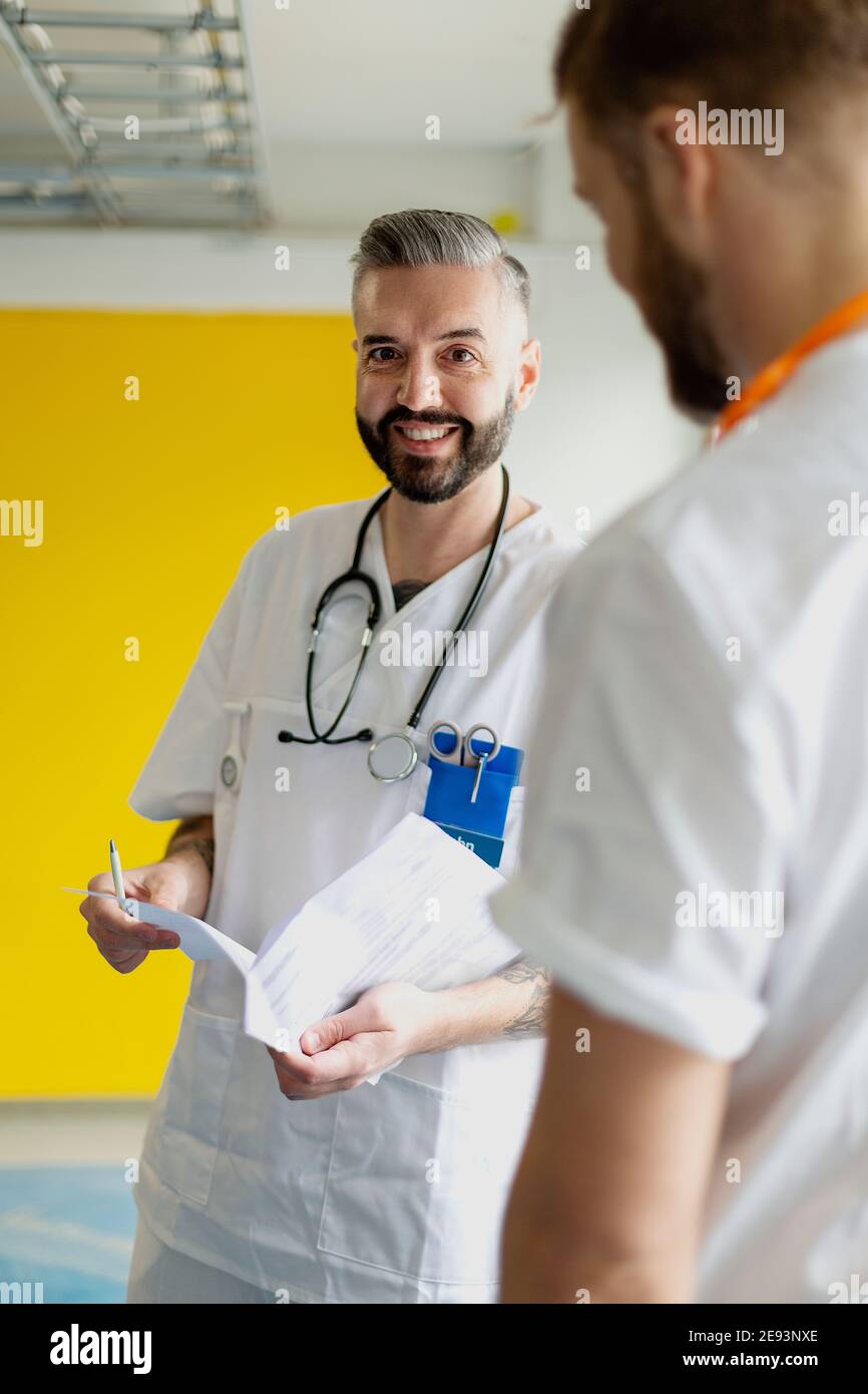 Doctors talking in hospital Stock Photo - Alamy