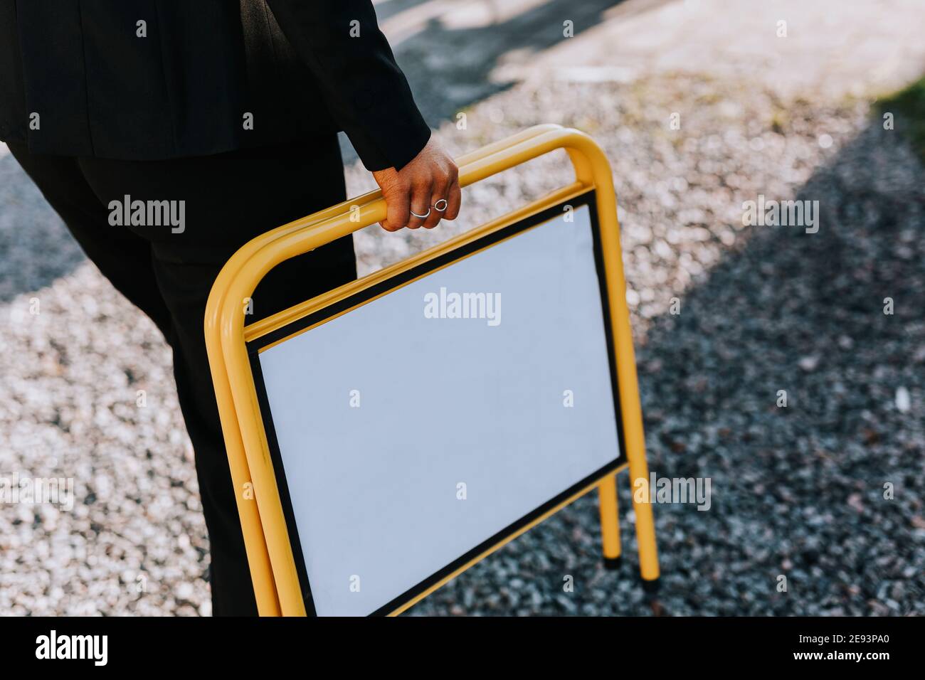 Womans hand holding sign Stock Photo - Alamy