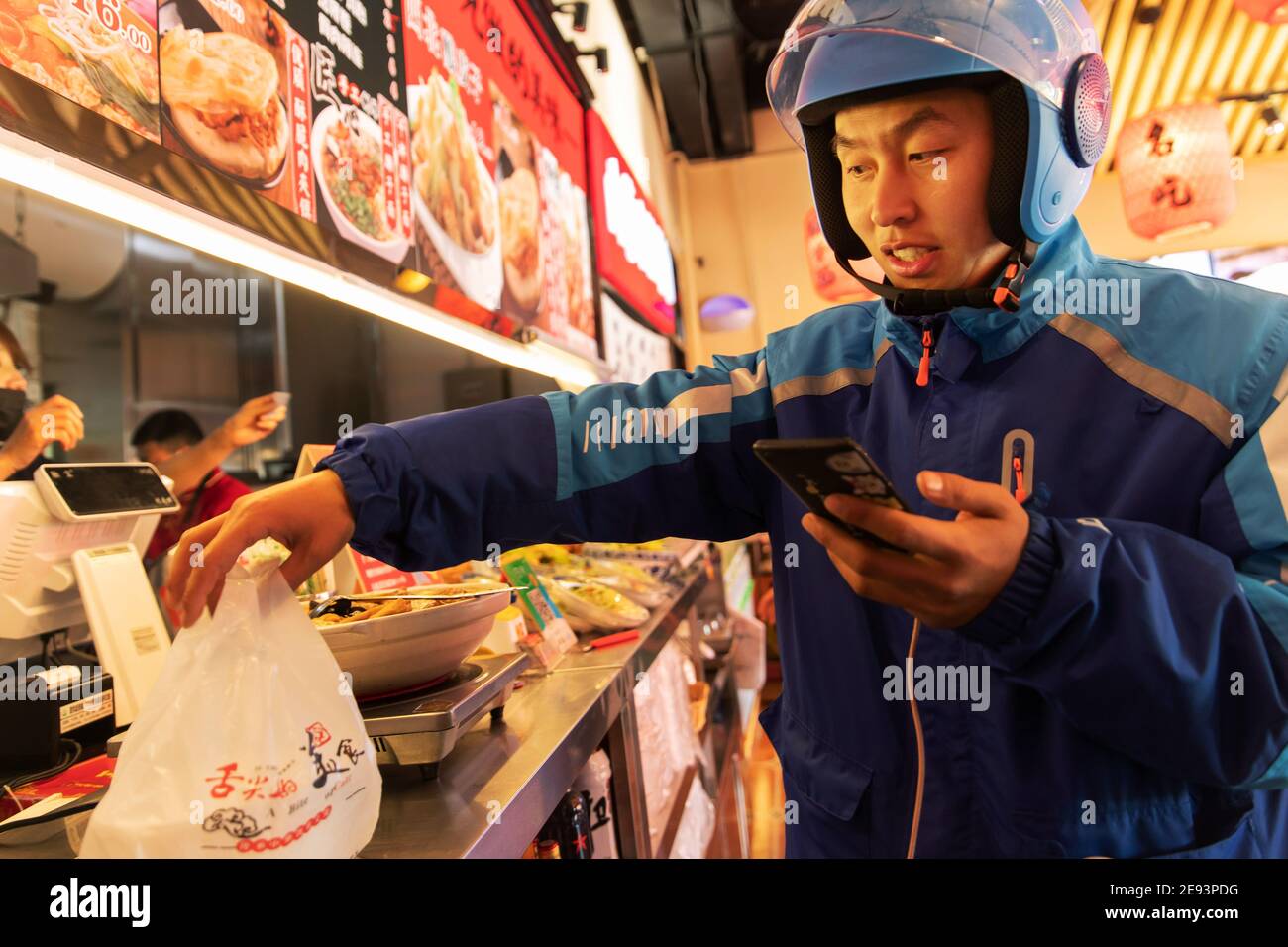 Take-away member take food in the restaurant Stock Photo - Alamy