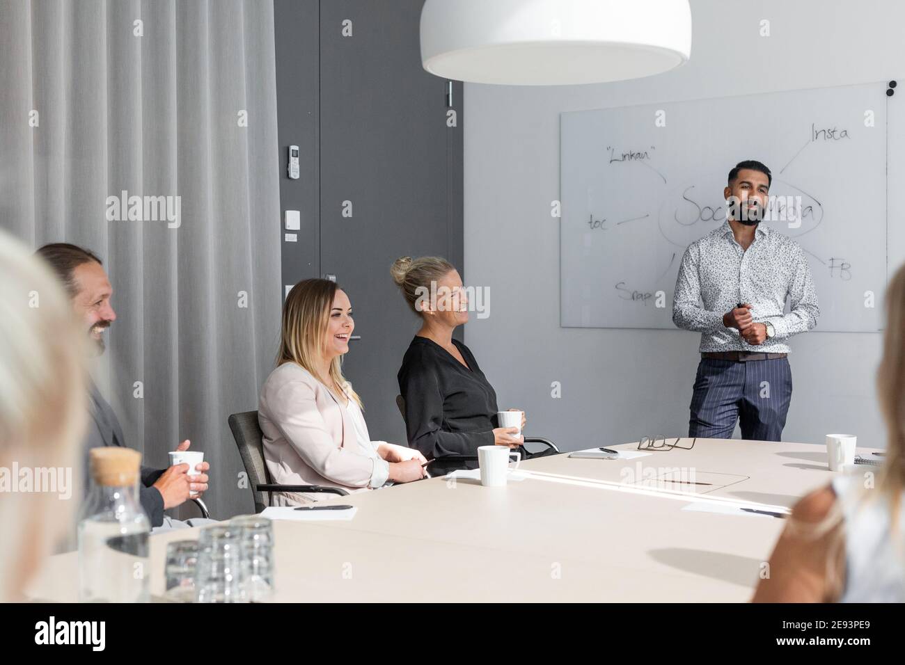 Man having presentation at business meeting Stock Photo - Alamy