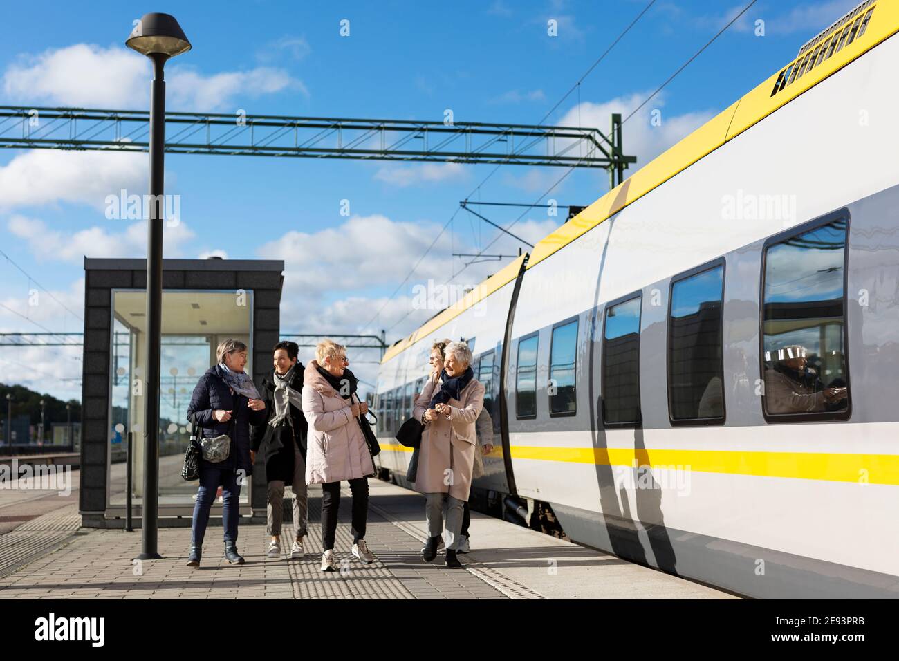 Passengers at train platform Stock Photo - Alamy