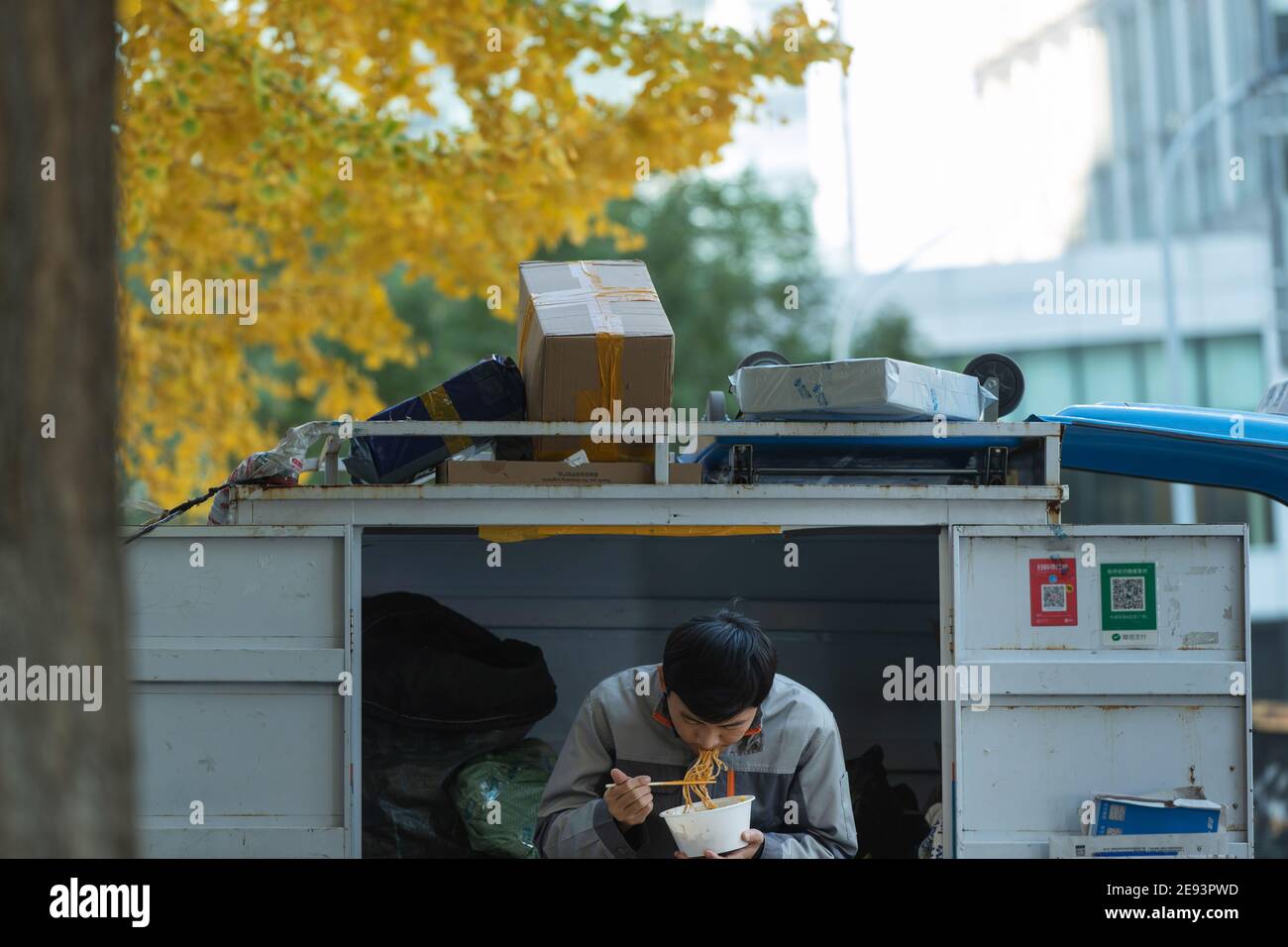 Indian man eating noodles hi-res stock photography and images - Alamy