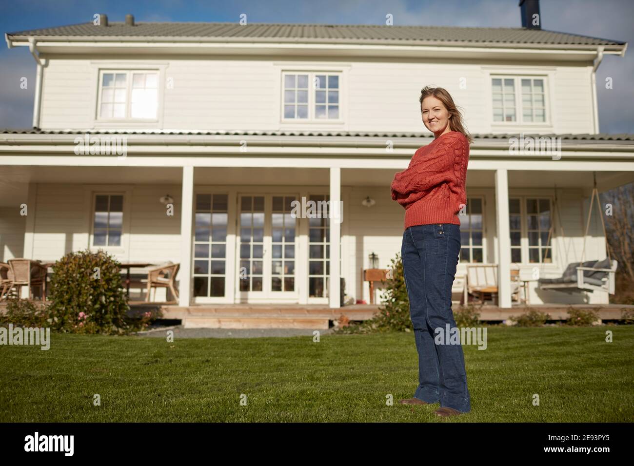 Woman front lawn house hi-res stock photography and images - Alamy