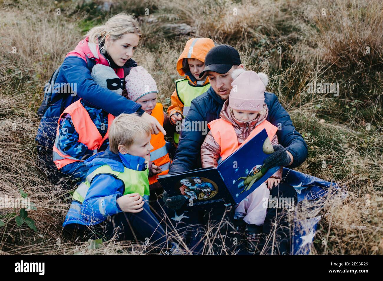 Children sitting boy girl angle hi-res stock photography and images - Alamy