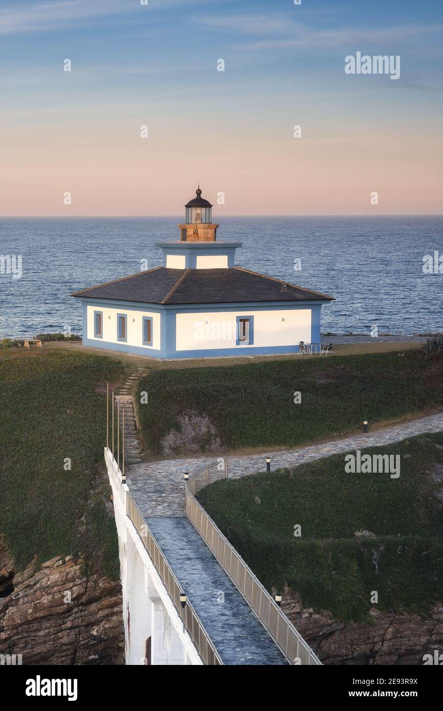 Vertical shot of an Isla Pancha lighthouse and a bridge with a ...