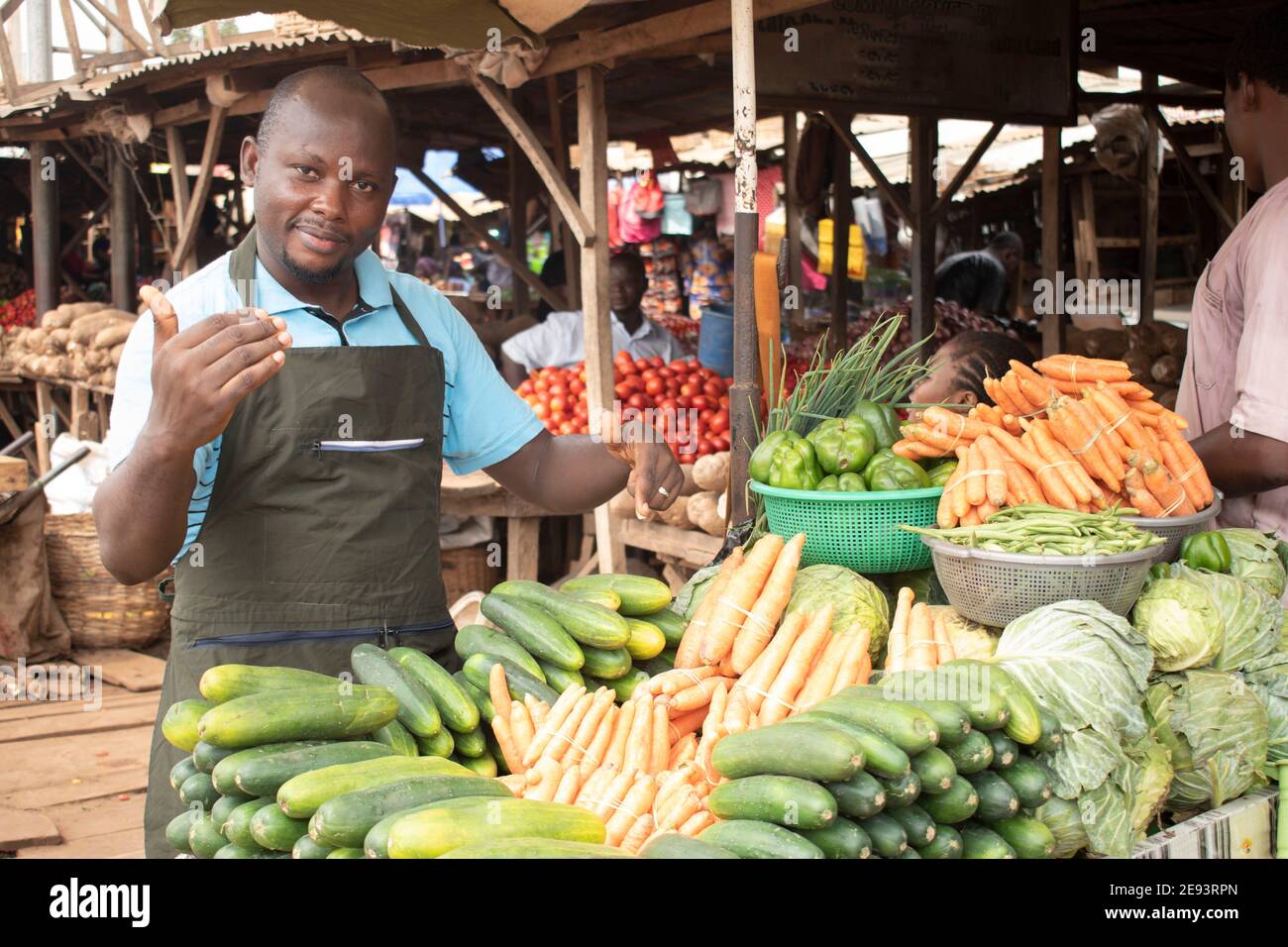 a man selling fruits in the local market Stock Photo - Alamy