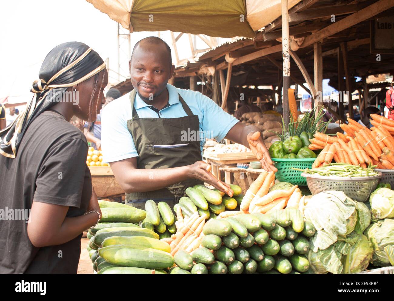 Black man selling vegetables hi-res stock photography and images - Alamy