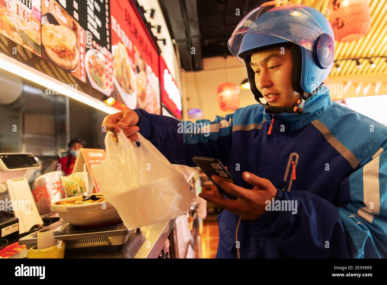 Take-away member take food in the restaurant Stock Photo - Alamy