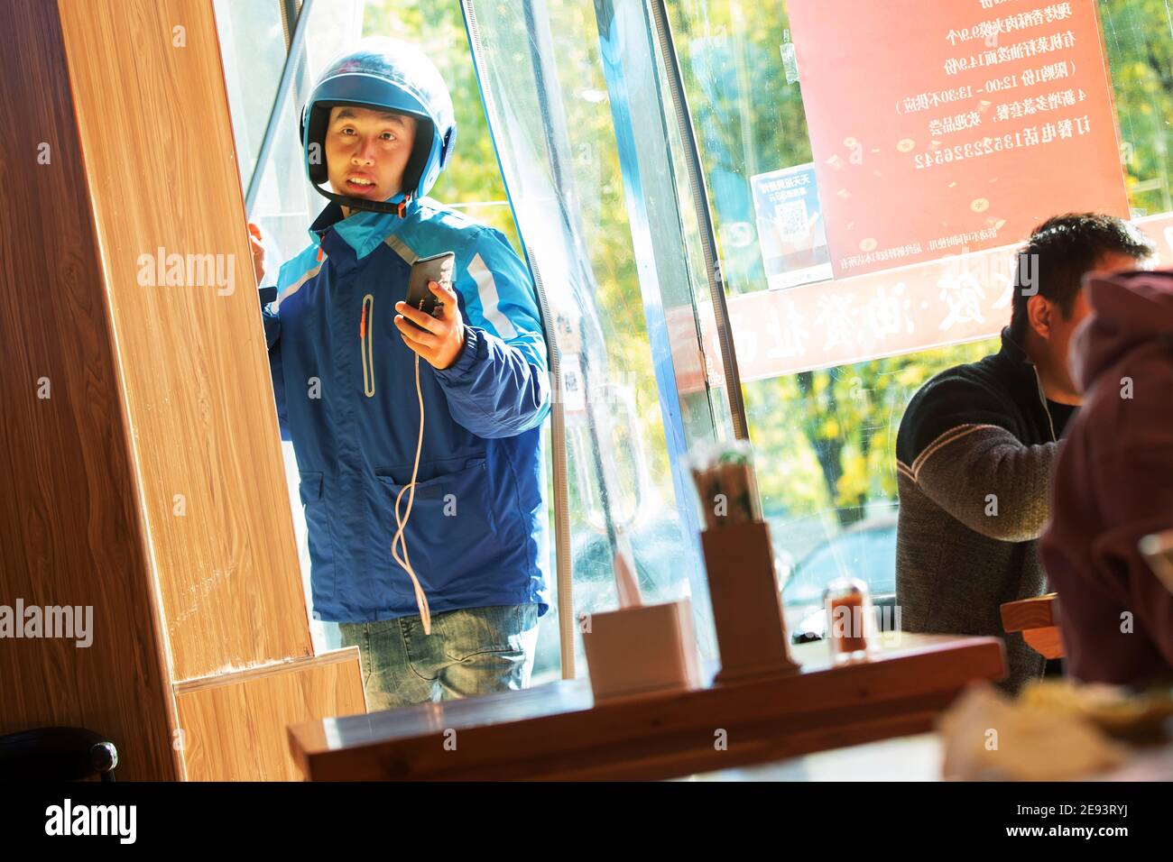 Take-out restaurant the door waiting to take food Stock Photo - Alamy