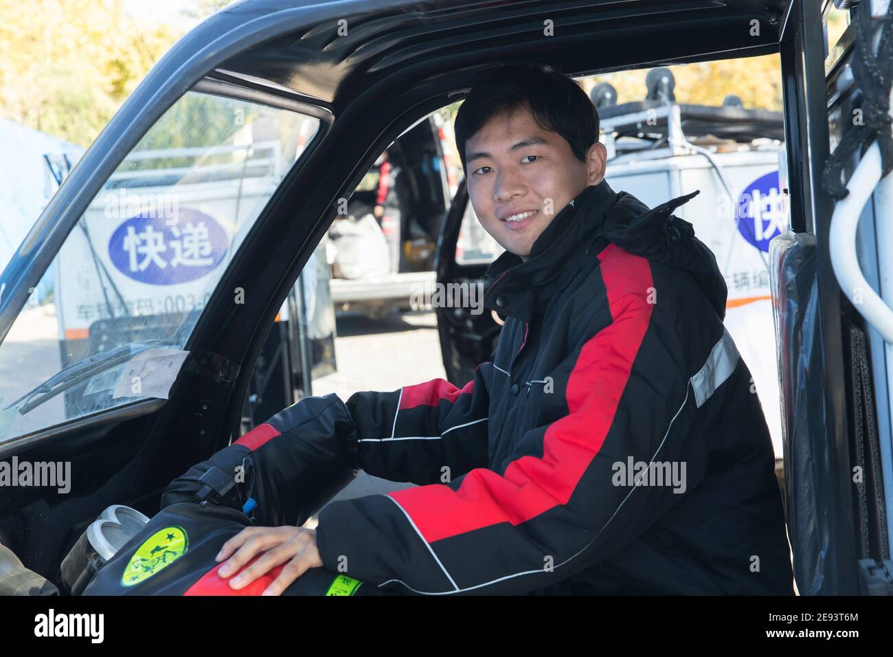 Driving tricycle Courier Stock Photo - Alamy