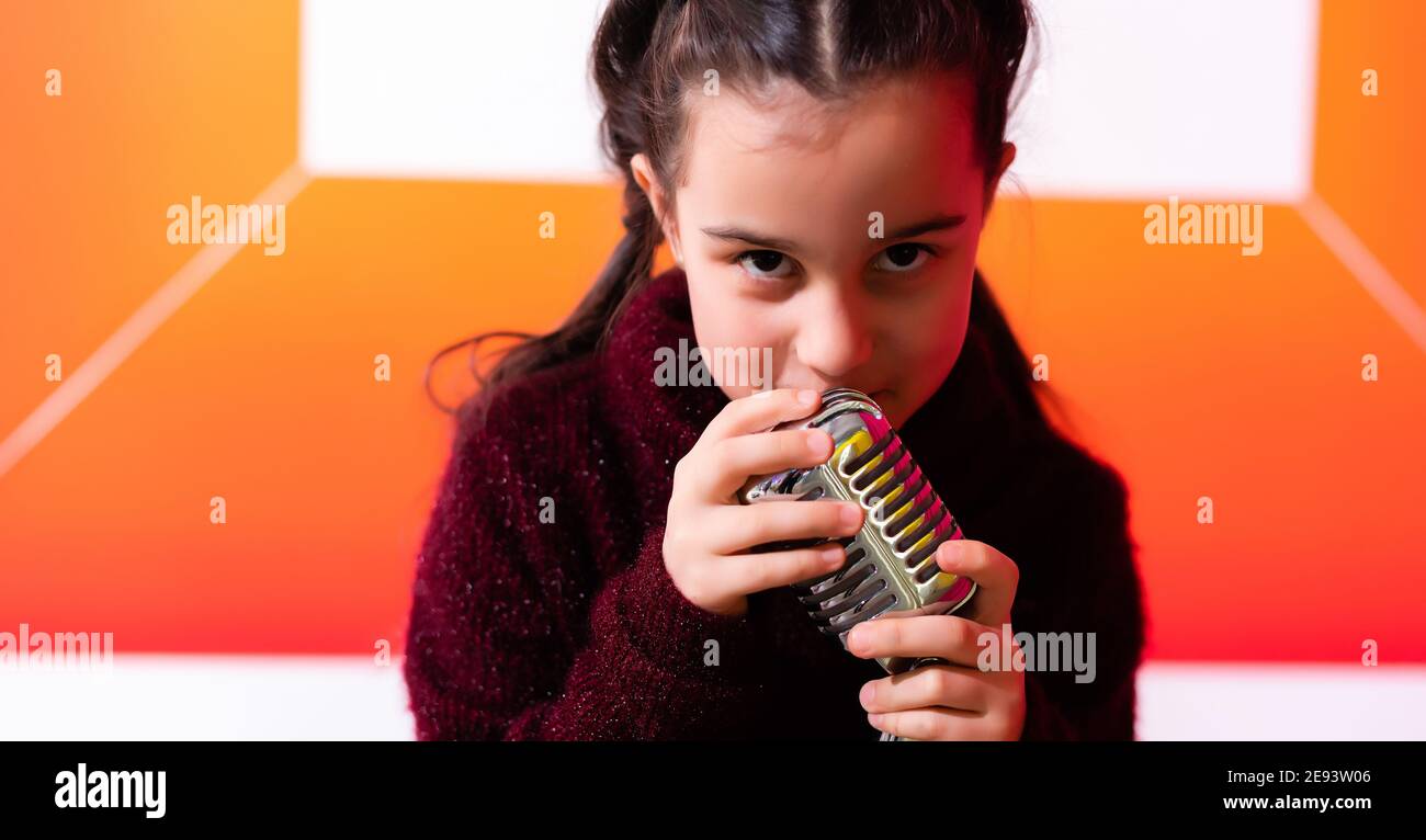 Regording studio. Child girl singing or role voicing Stock Photo - Alamy