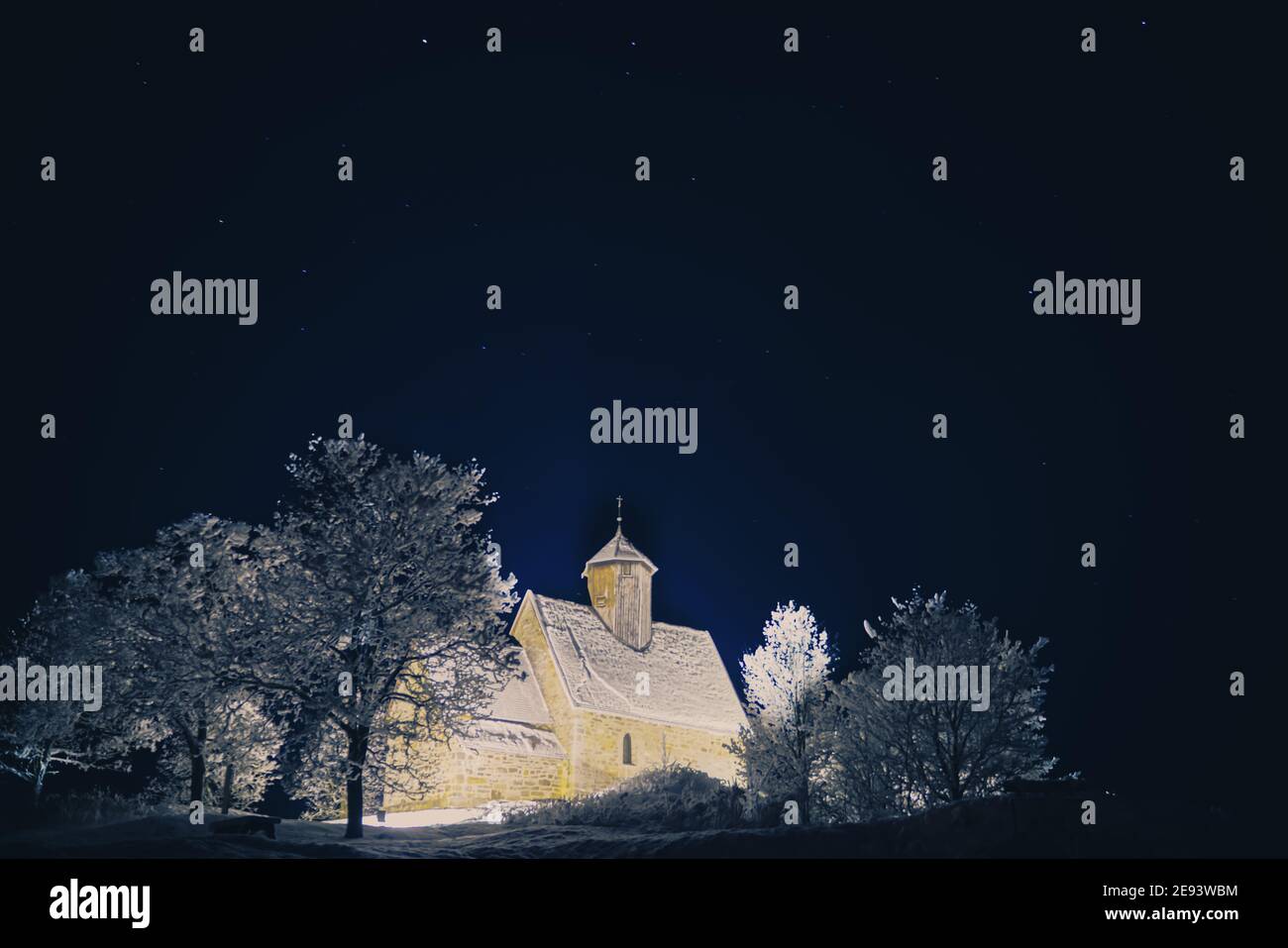 Old medieval church lit up on a cold starry winters night Stock Photo ...