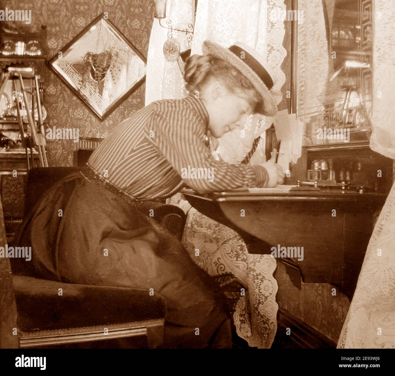 Lady writing at her desk, early 1900s Stock Photo - Alamy