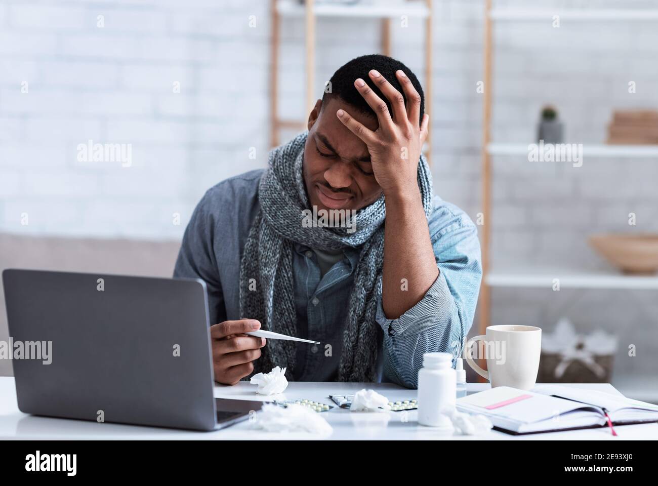 Ill African Man Having Fever Sitting At Workplace In Office Stock Photo ...