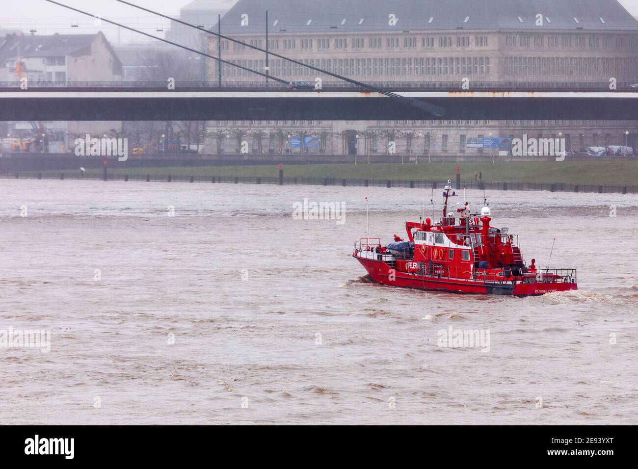 Flood on the Rhine in Dusseldorf - fire boat during a patrol towards ...